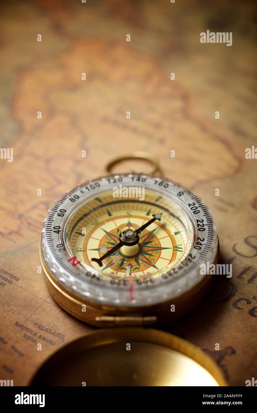 Vintage compass and old navigation map Stock Photo - Alamy