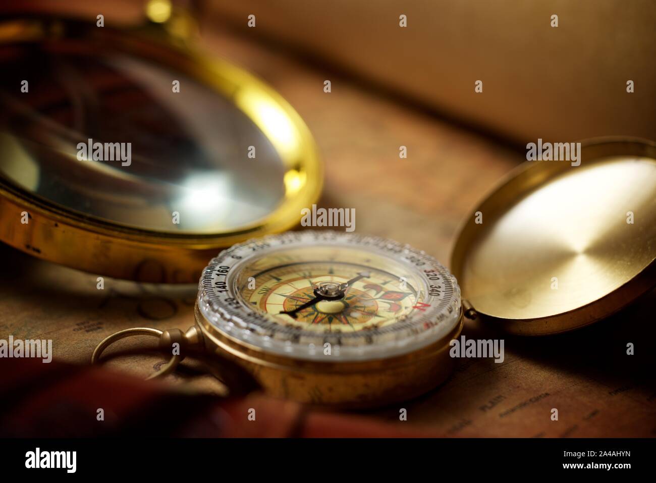 Vintage compass and old navigation map Stock Photo - Alamy