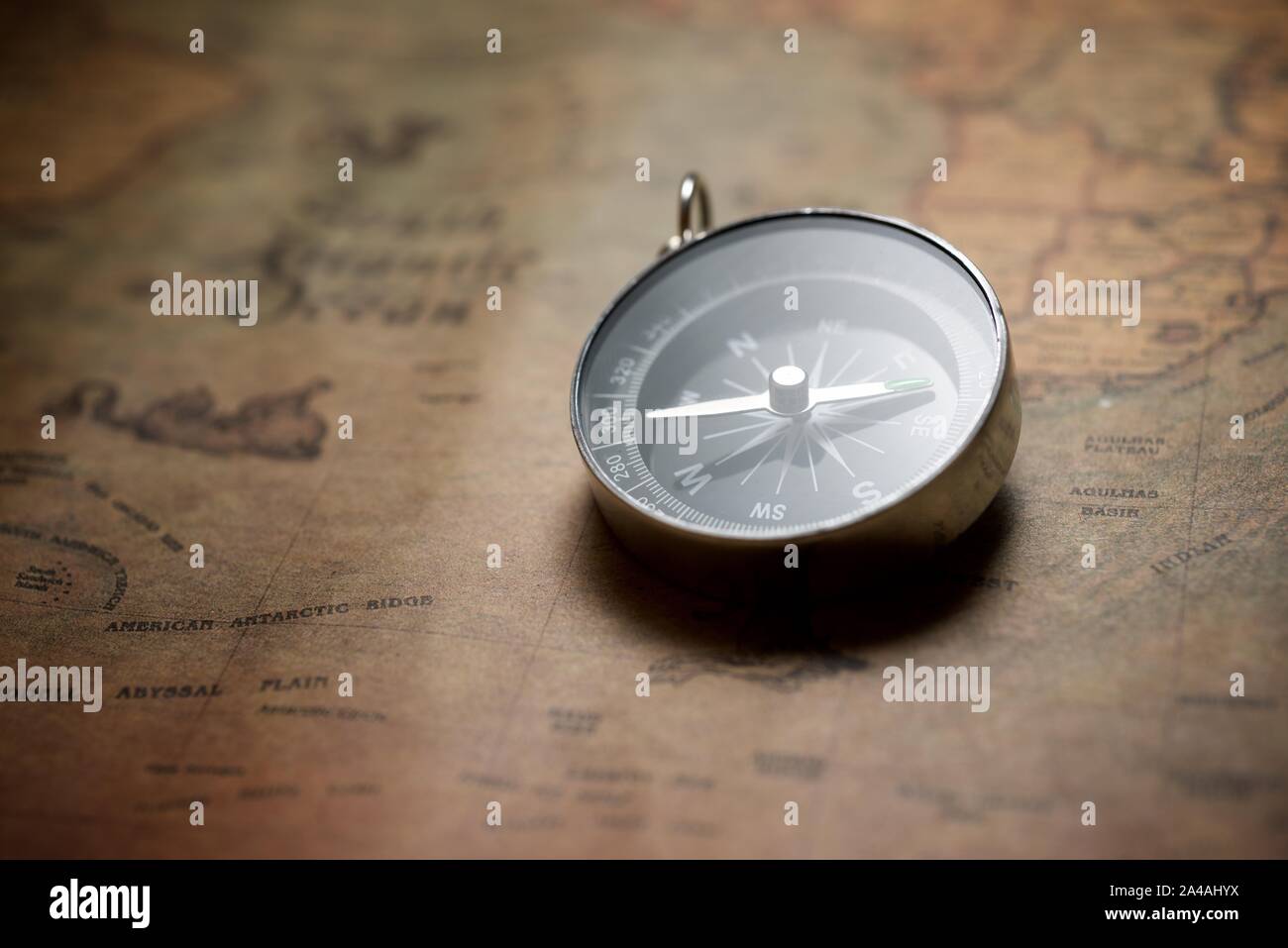 Vintage compass and old navigation map Stock Photo - Alamy