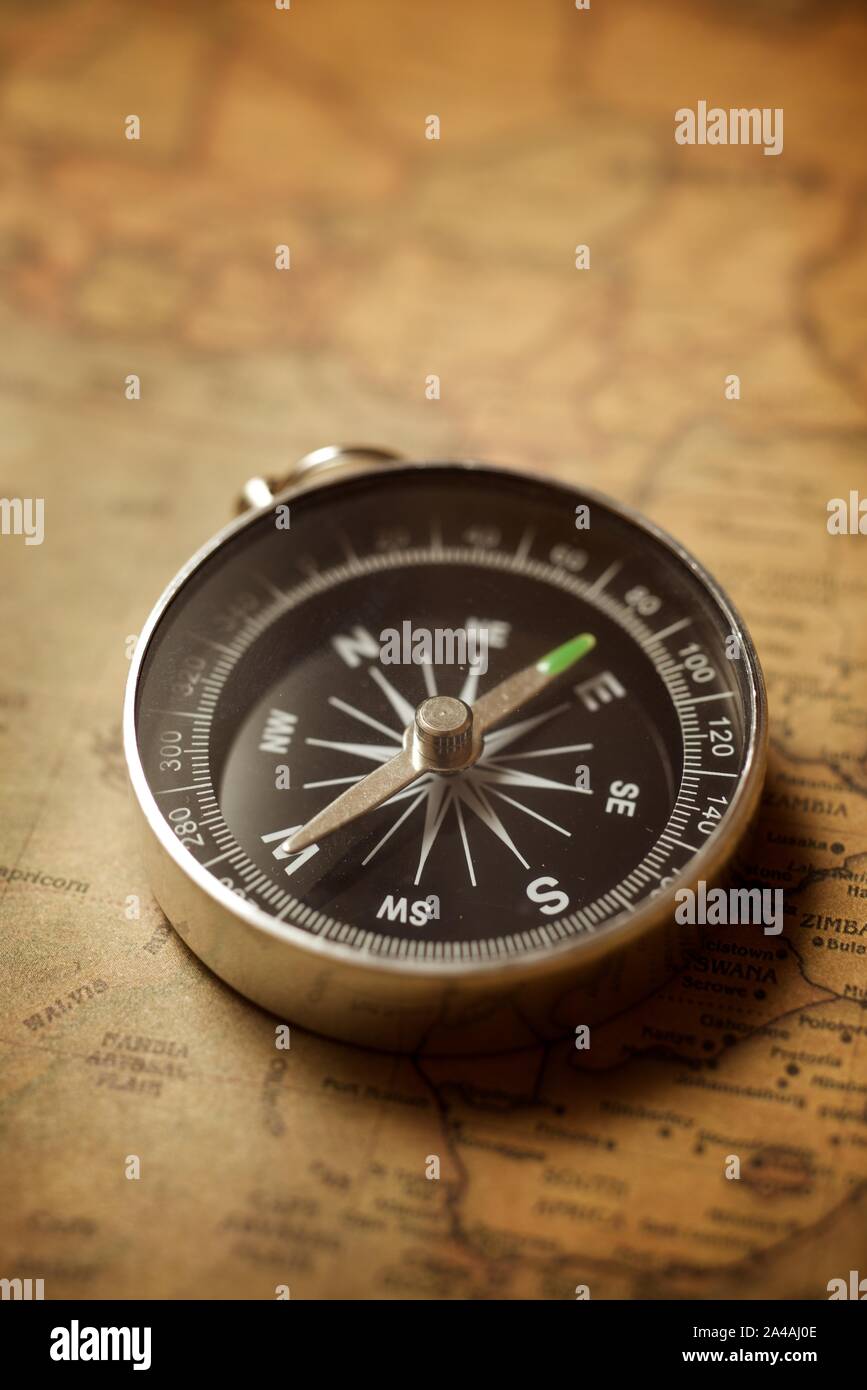 Vintage compass and old navigation map Stock Photo - Alamy