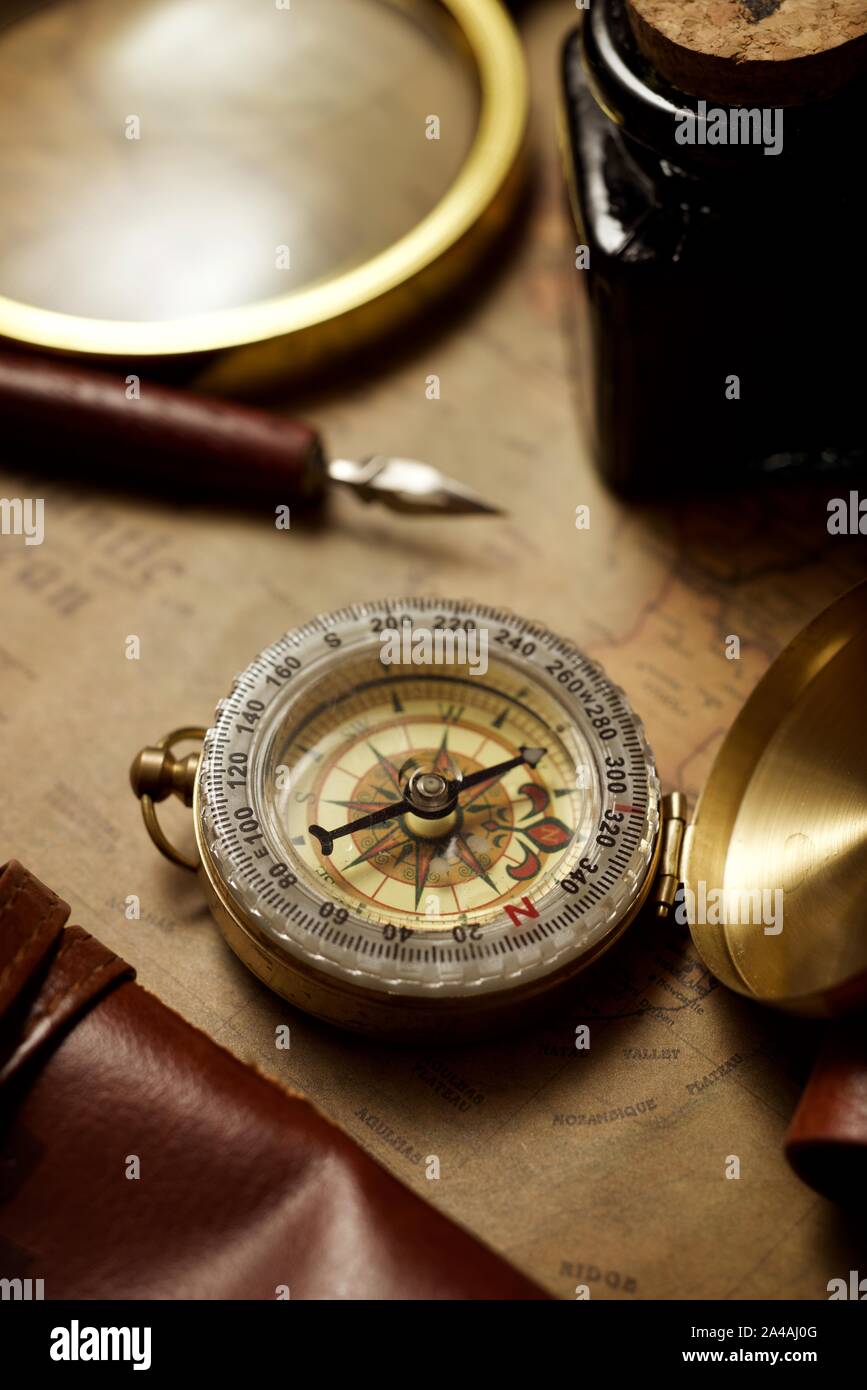 Vintage compass and old navigation map Stock Photo - Alamy
