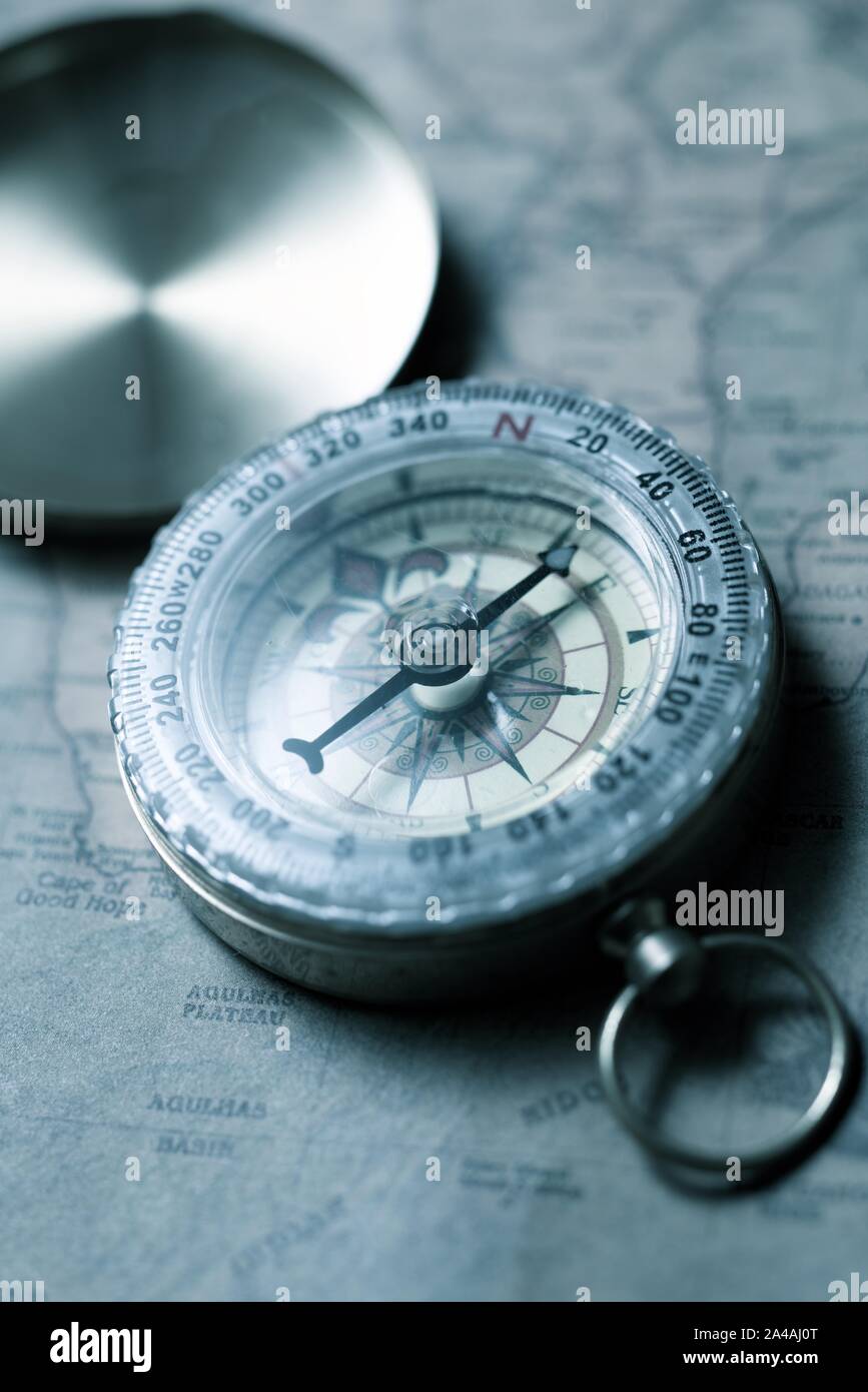 Vintage compass and old navigation map Stock Photo - Alamy