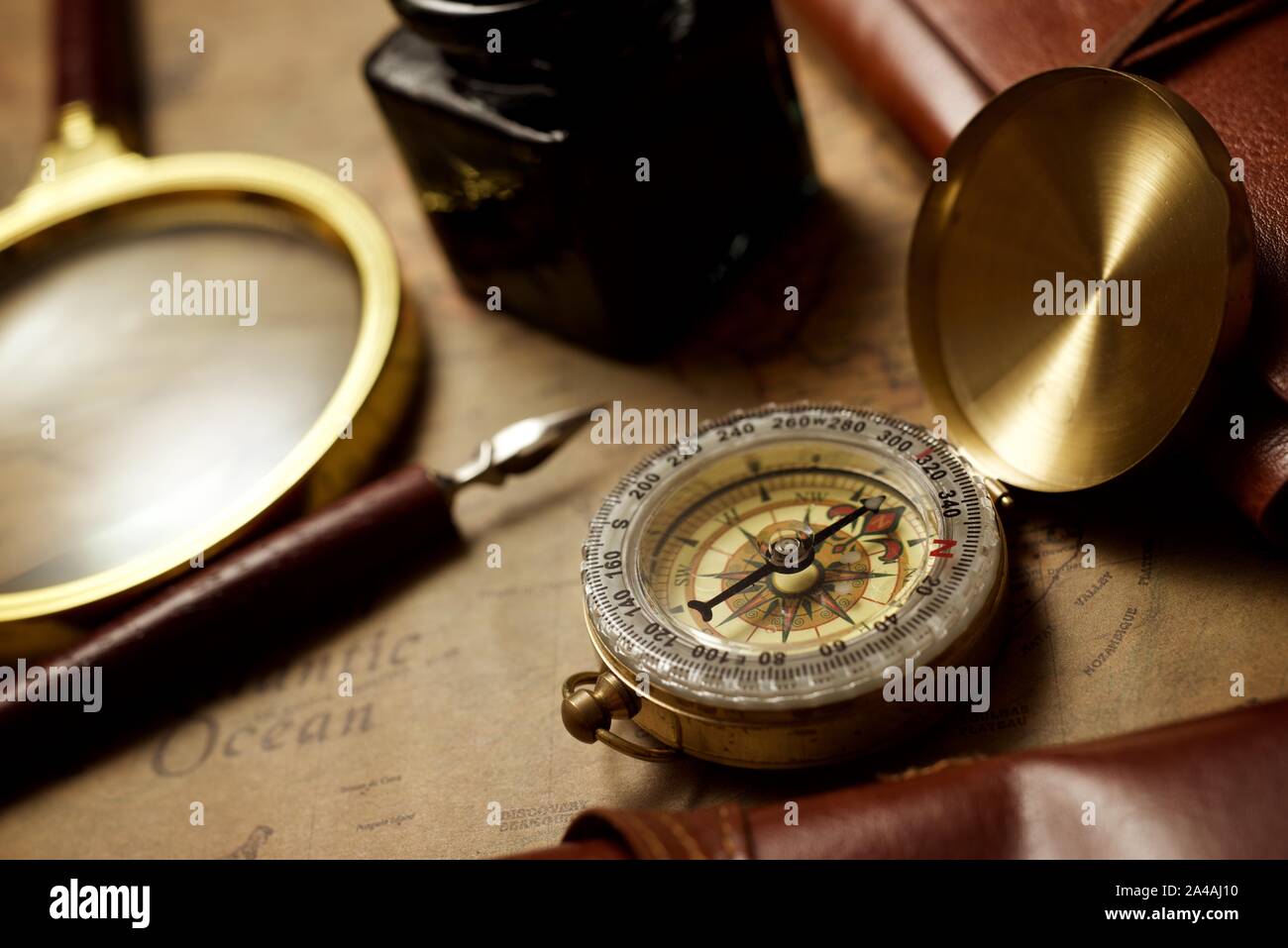 Vintage compass and old navigation map Stock Photo - Alamy