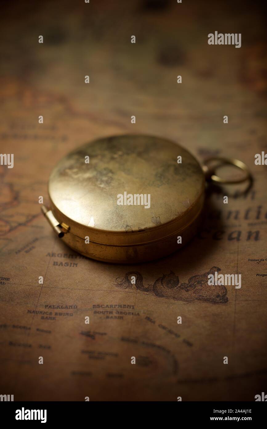 Vintage compass and old navigation map Stock Photo - Alamy