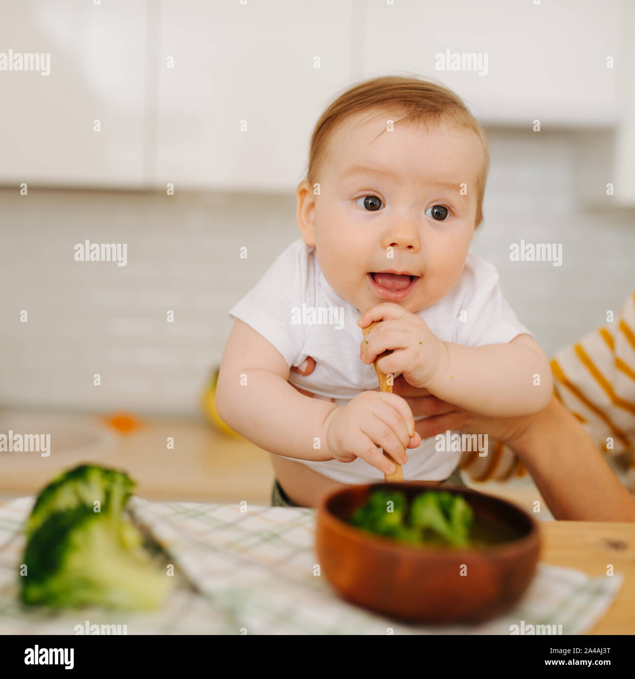 Child given food hi-res stock photography and images - Alamy