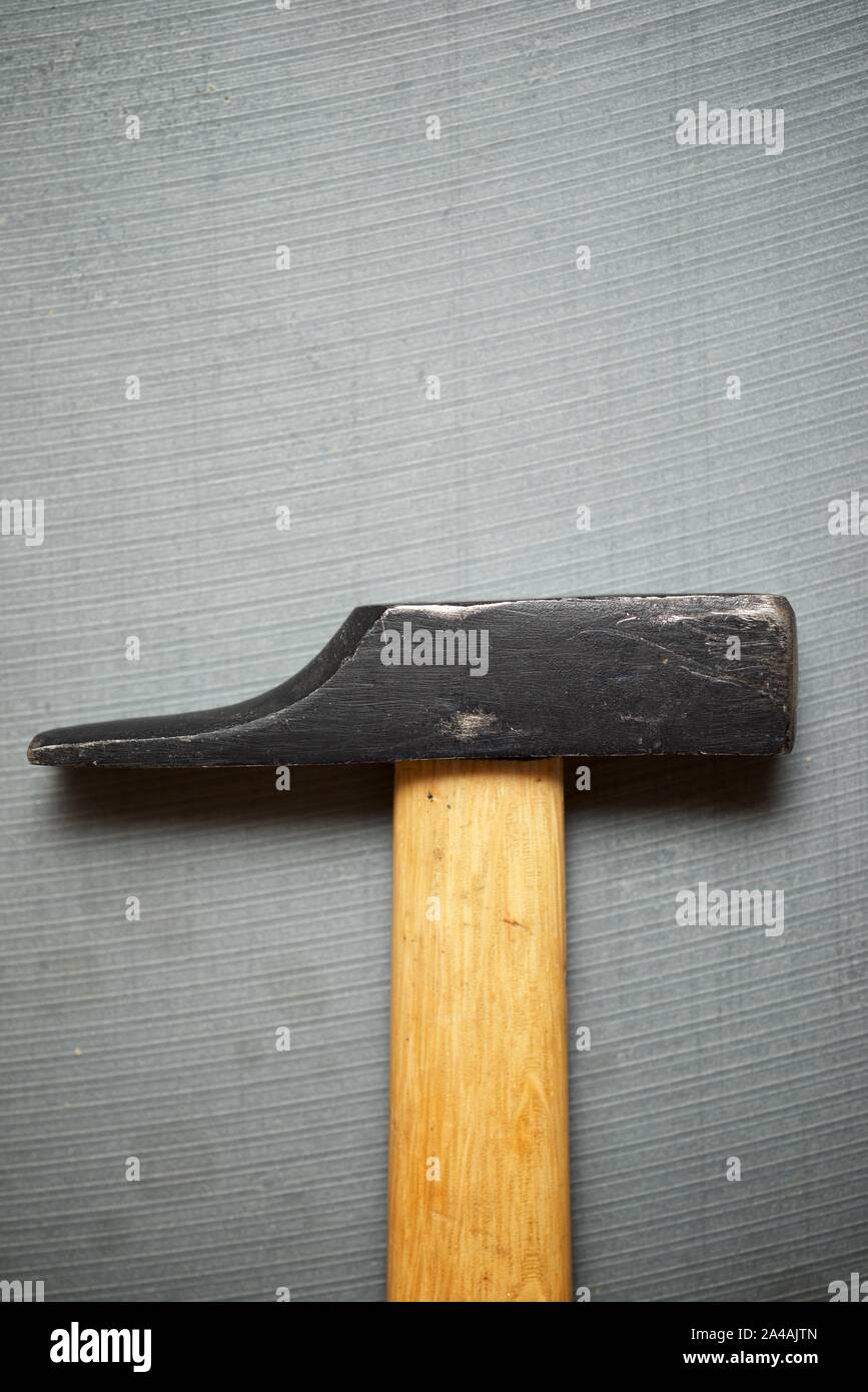 Hammer on a stone table Stock Photo - Alamy