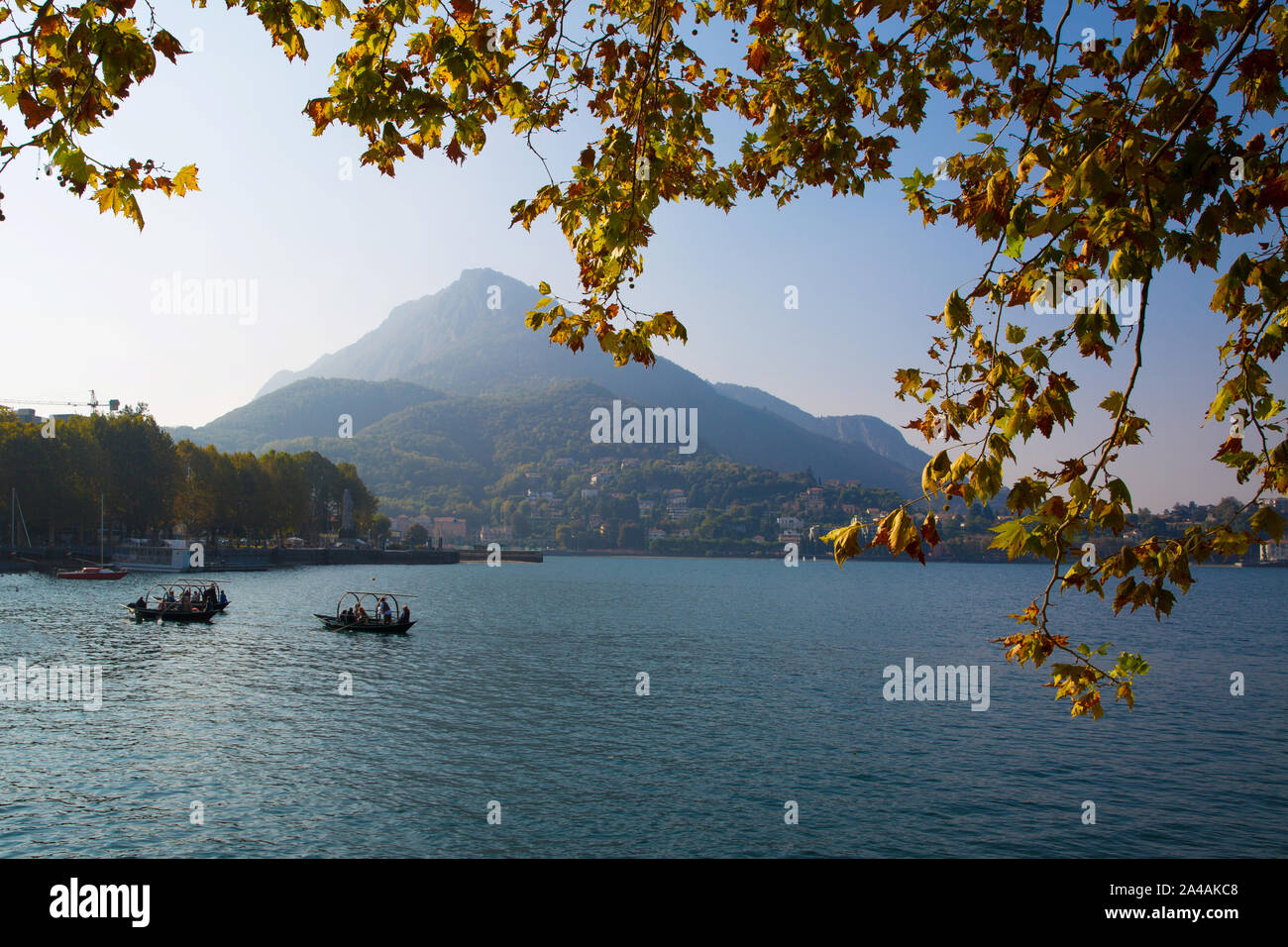Como lake in Italy. Yellow leaves and Alp mountains beautiful autumn ...