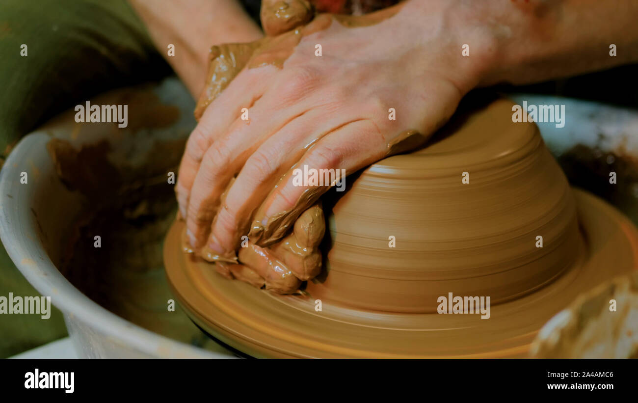 Professional male potter making bowl in pottery workshop Stock Photo ...
