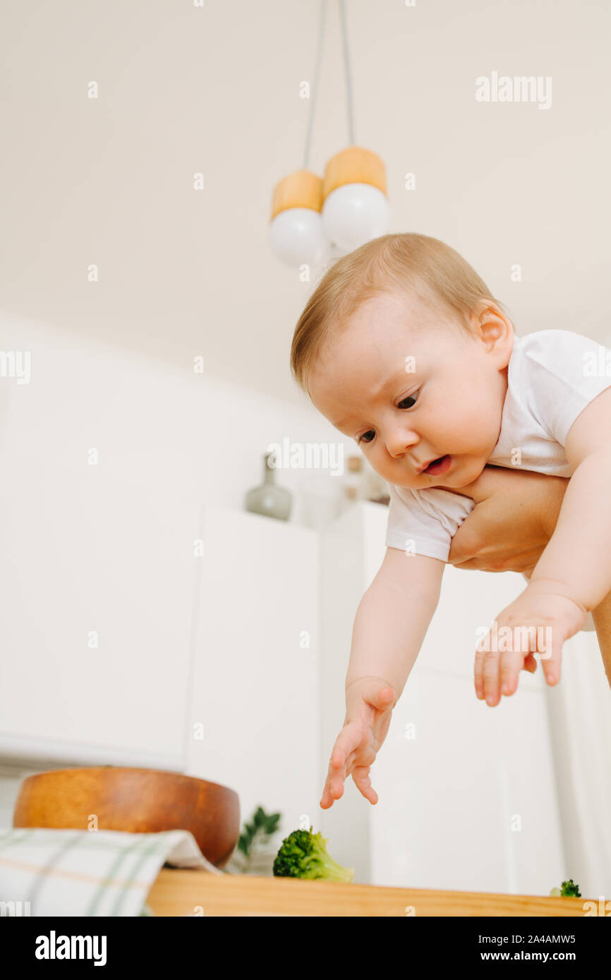Active restless infant child is given food Stock Photo - Alamy