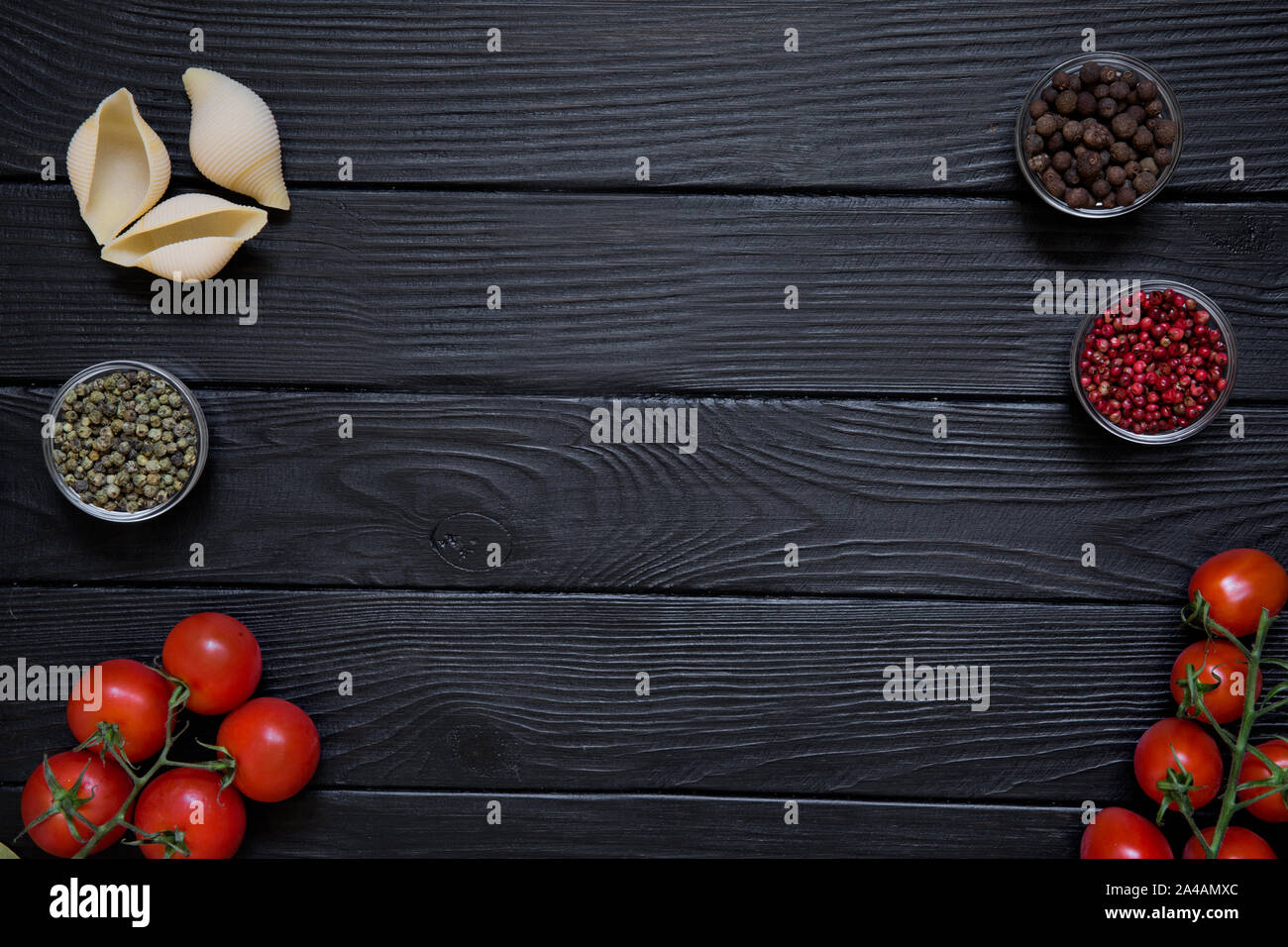 Fresh ingredient for Italian cuisine dishes on black wooden table ...