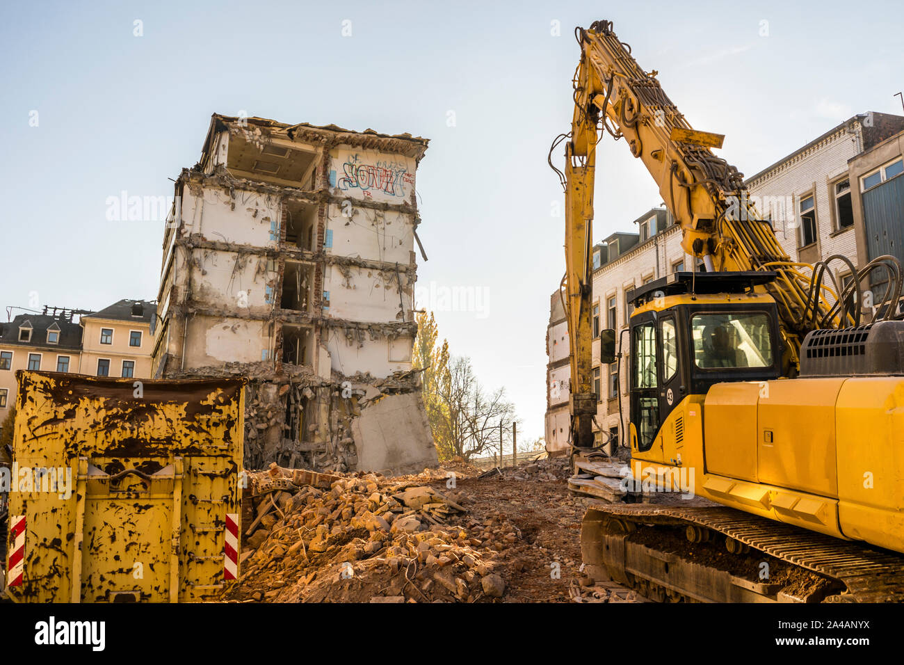 Demolition house using excavator in city. Rebuilding process Stock ...