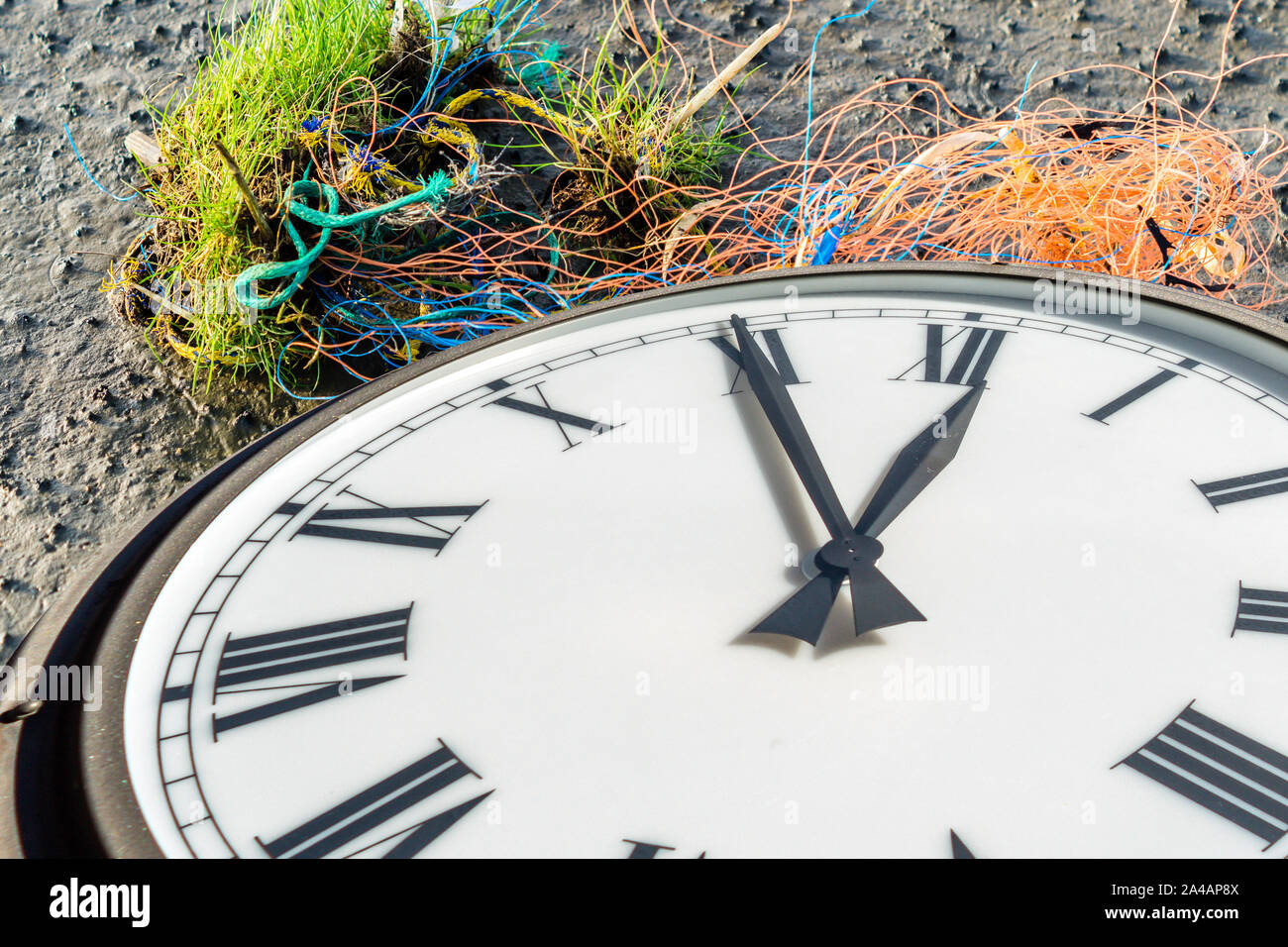 Plastic garbage Ocean clock Stock Photo - Alamy