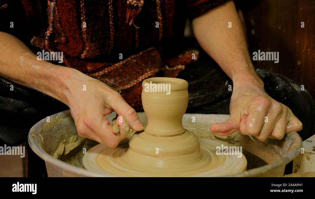 Professional male potter working in workshop, studio Stock Photo - Alamy