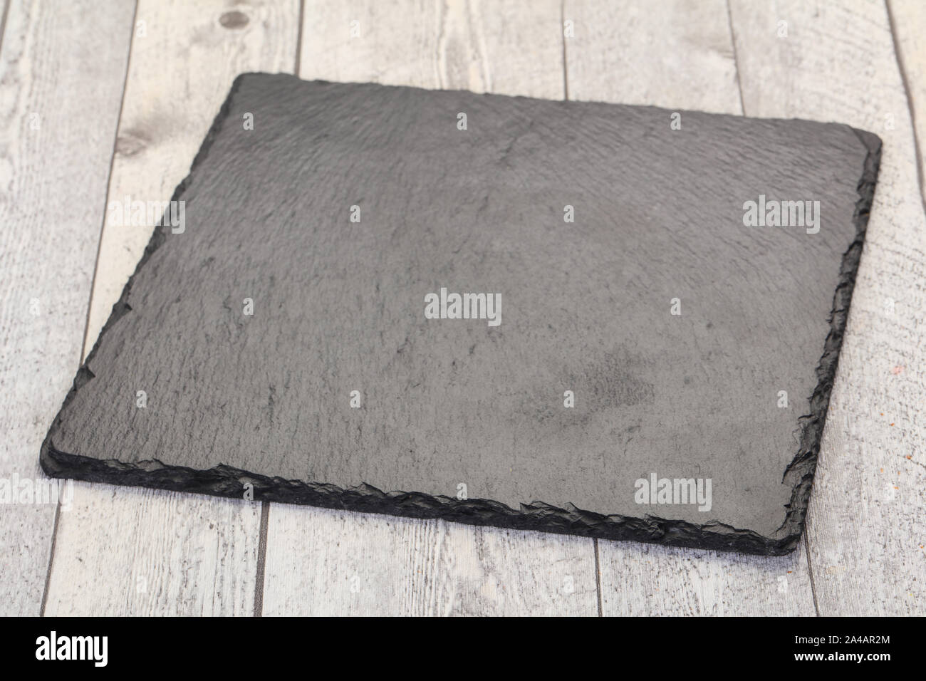 Stone board for serving dishes - kitchenware Stock Photo - Alamy