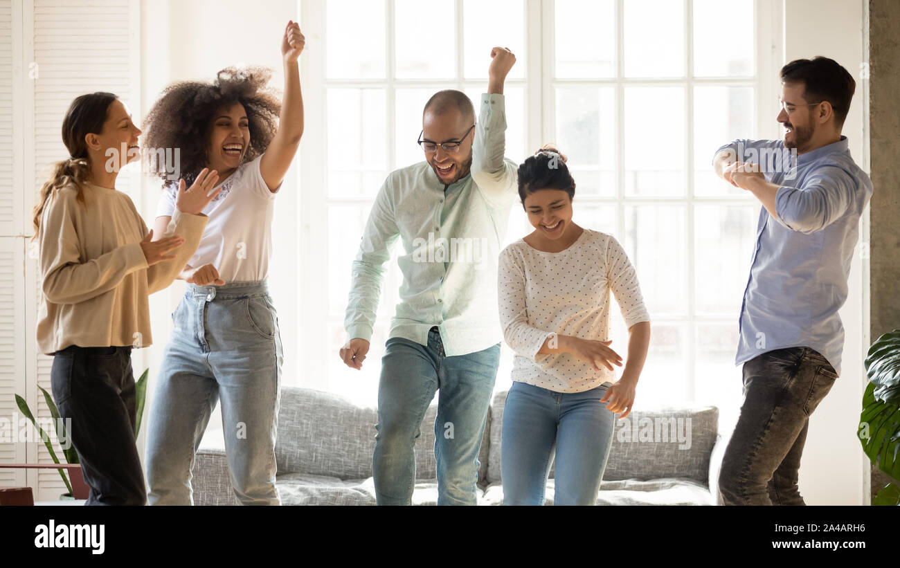 Excited group friends dancing hi-res stock photography and images - Alamy