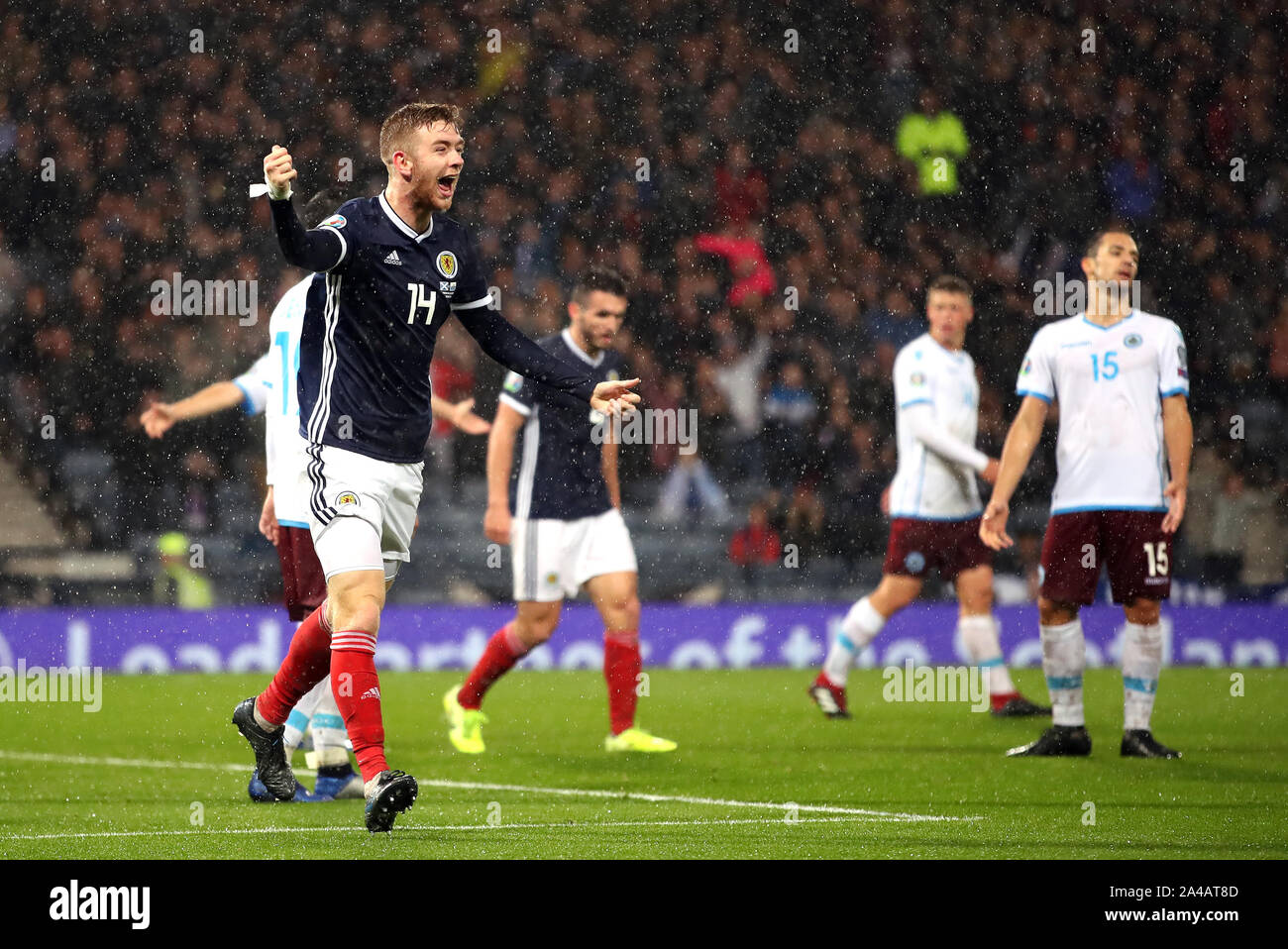 Scotland's Stuart Findlay (centre) celebrates scoring his sides fifth ...