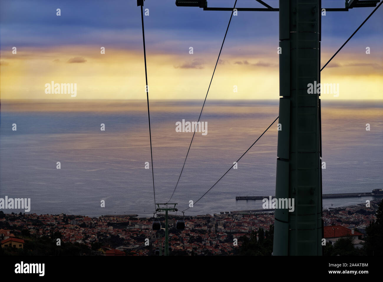 Cables of a funicular from Monte to Funchal at sunset. Portuguese ...