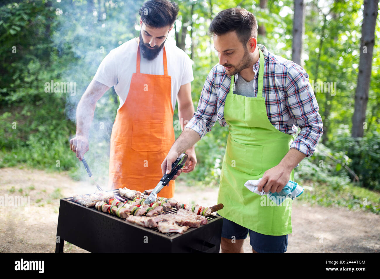 Barbecue party men hi-res stock photography and images - Alamy