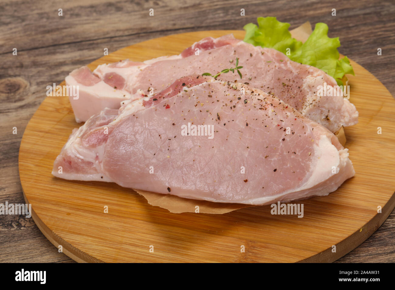 Raw pork meat steak ready for grill Stock Photo - Alamy
