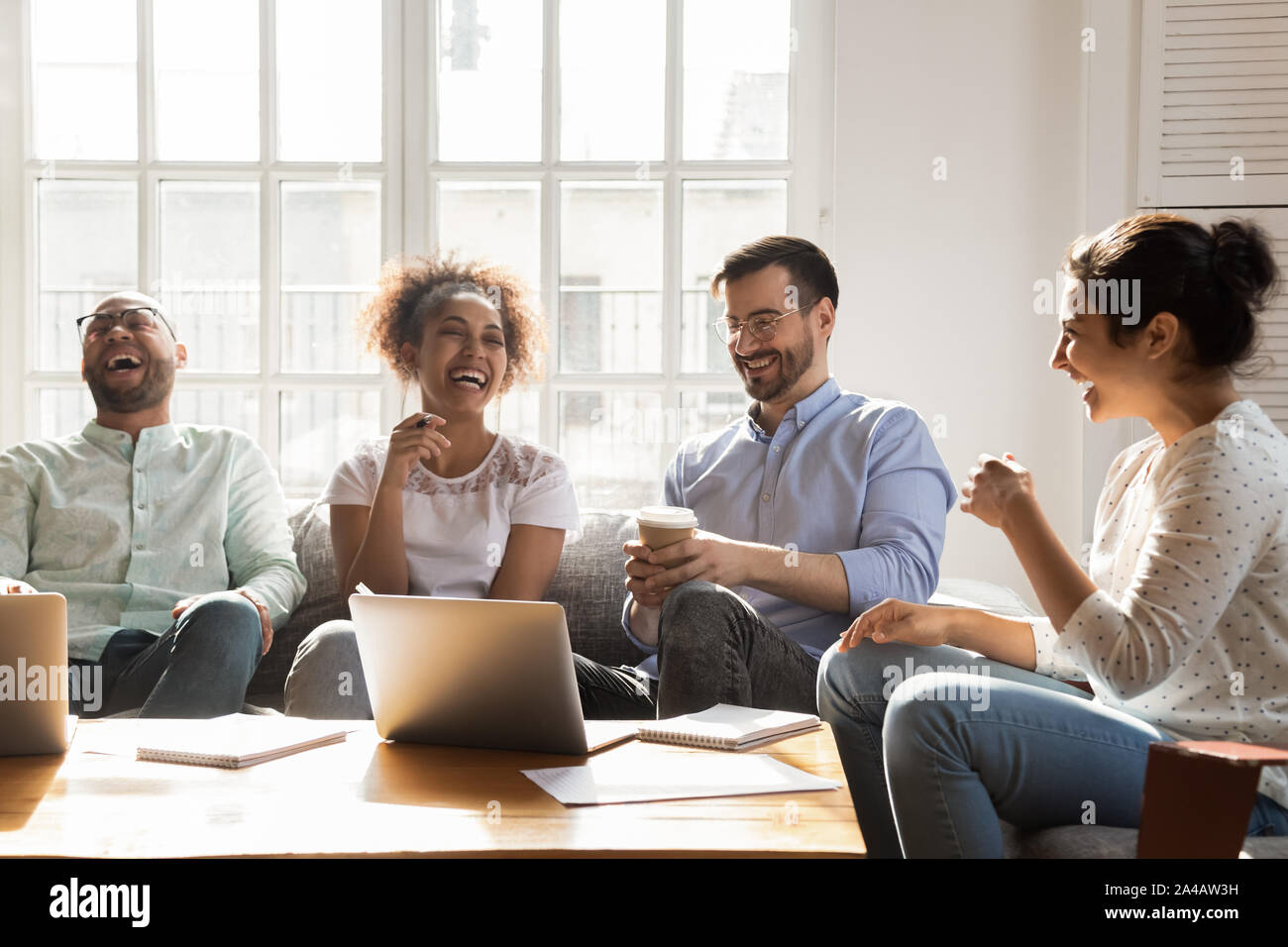 Happy diverse friends having fun, laughing at funny joke Stock Photo ...