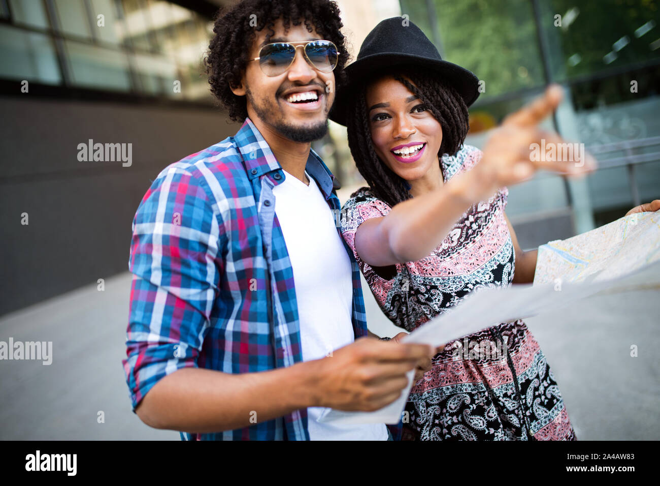 Young beautiful funny couple in love having fun outdoor on the street ...