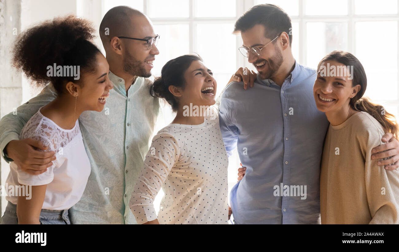 Happy diverse friends standing together, embracing, having fun Stock ...