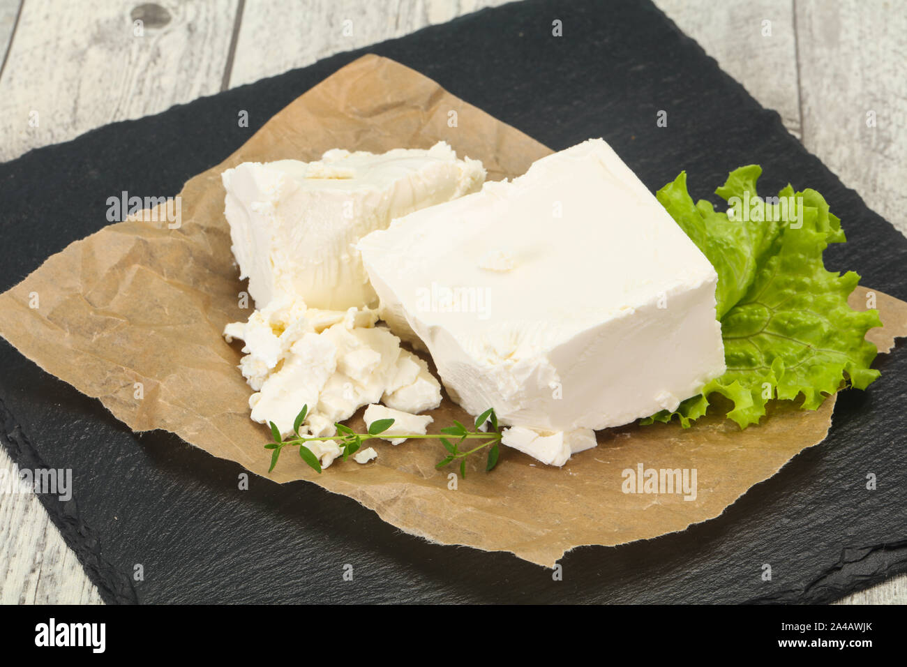 Greek traditional Feta soft cheese in the plate Stock Photo - Alamy