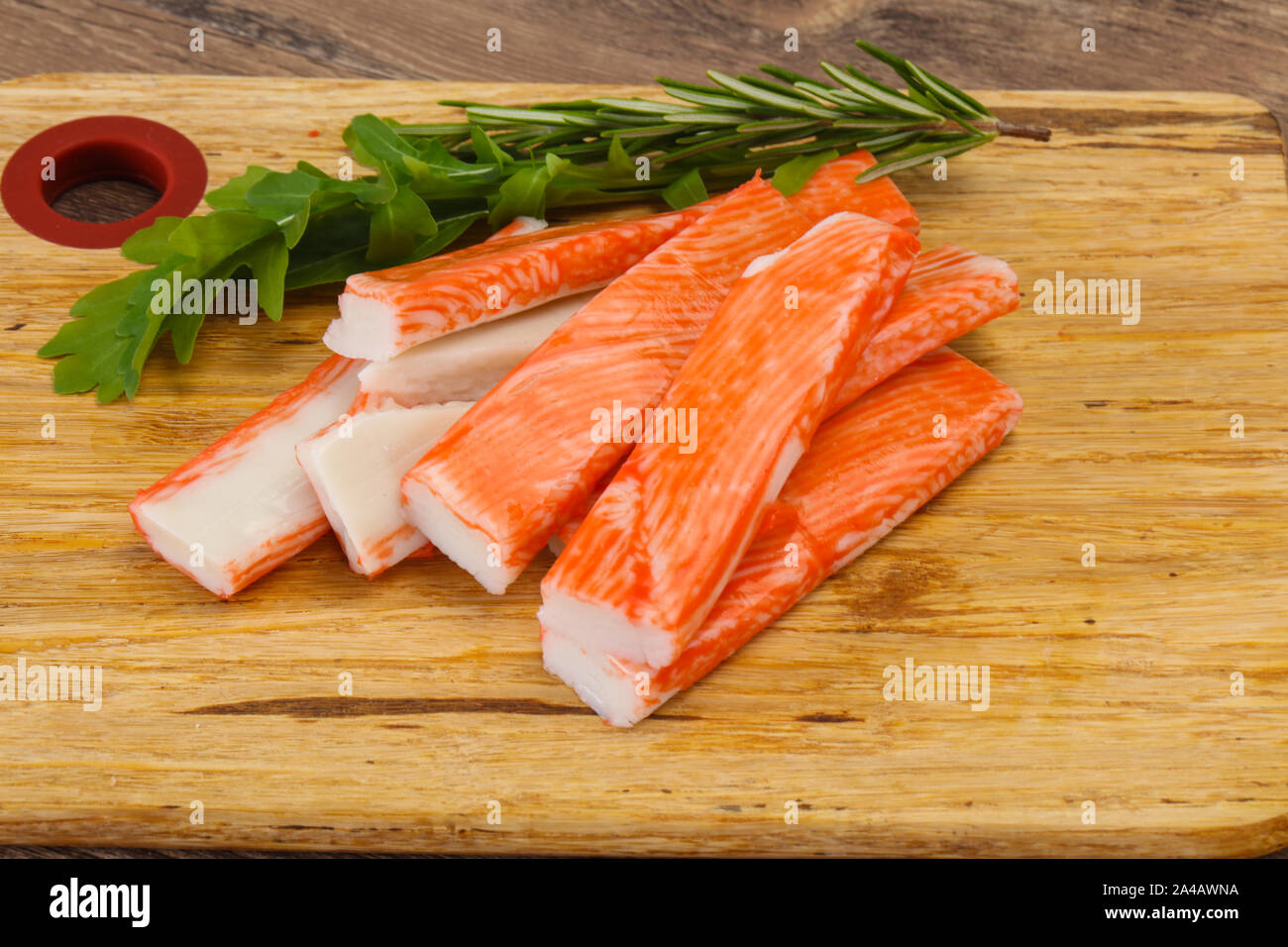 Crab stick surimi over wooden board Stock Photo - Alamy