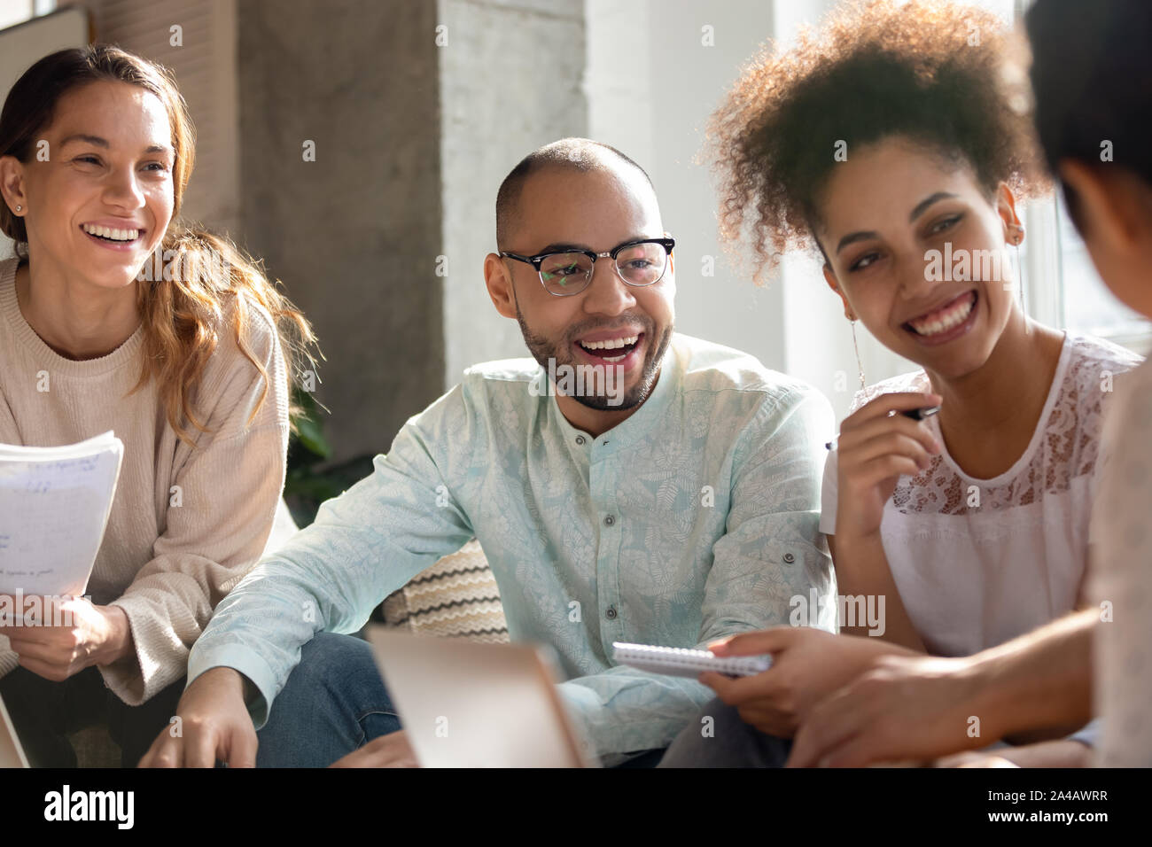 Happy diverse students having fun together, discussing project close up ...