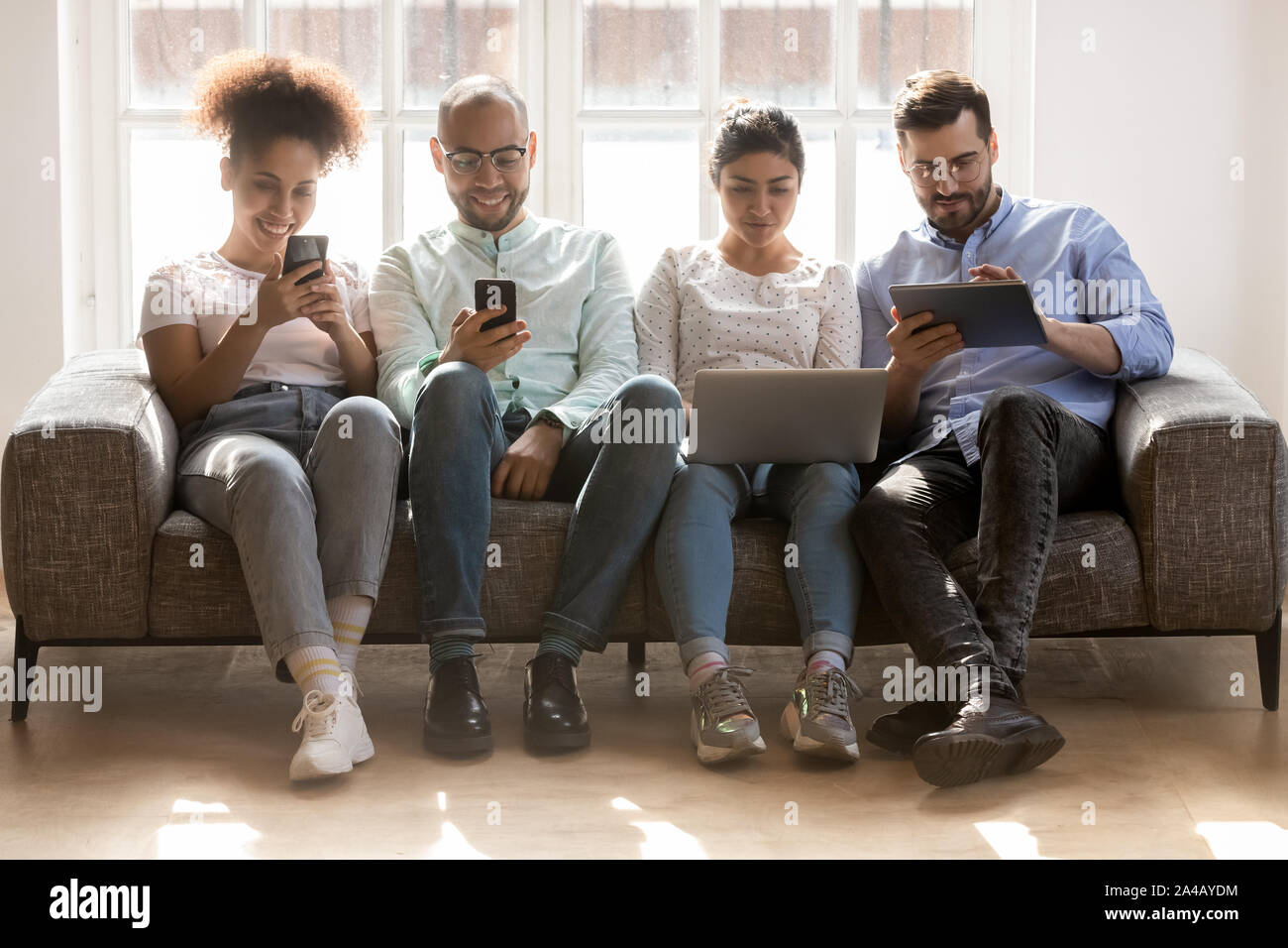 Digital addiction diverse people mobile hi-res stock photography and ...