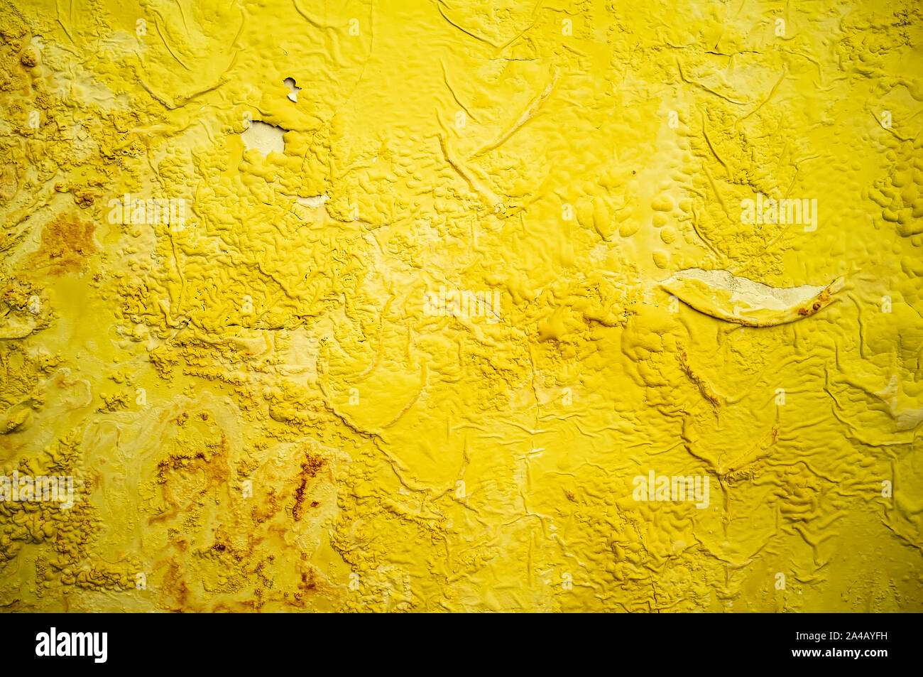 Old flaky yellow paint on the wall. Texture. Background. Close-up Stock ...