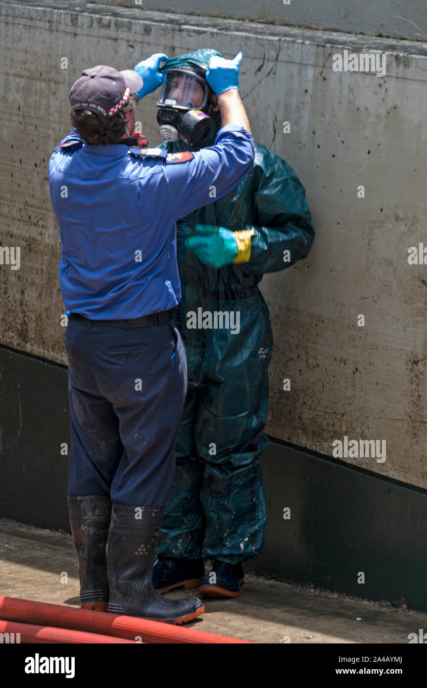 A fire fighter of the Queensland fire and rescue service being prepared ...