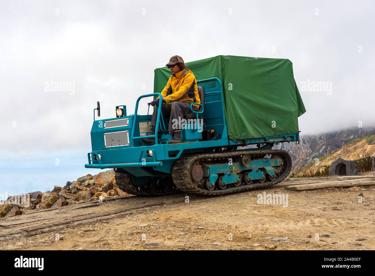 A Man Is Driving The Land Rover. Cross Country All Terrain Vehicle Has ...
