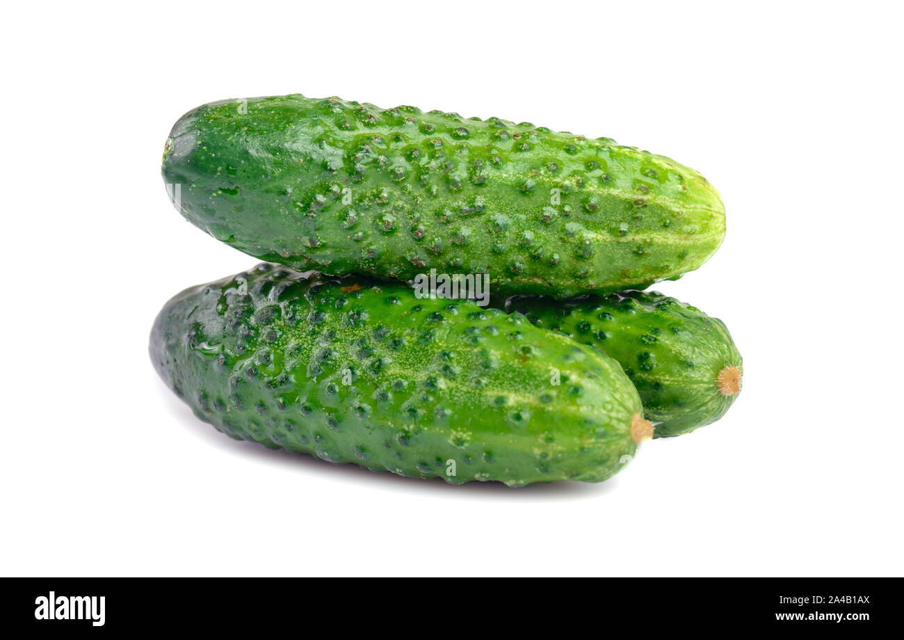 Small pile of cucumbers isolated on white background Stock Photo - Alamy