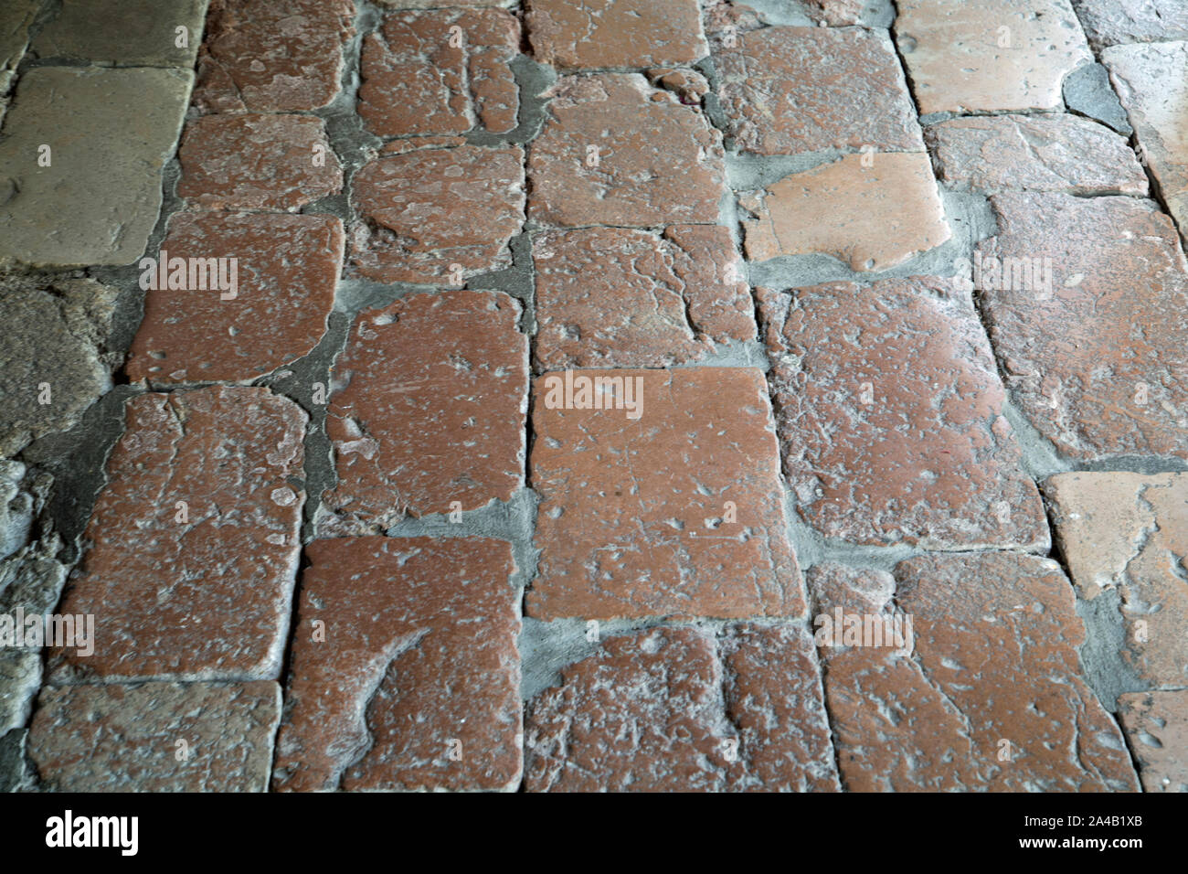 Ancient polished red brick floor tiles shot for use as a background ...