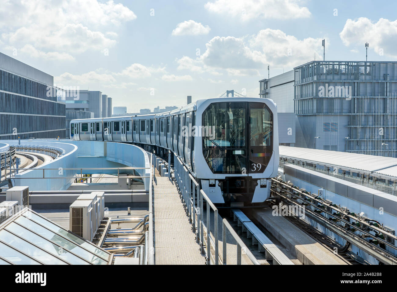 The Monorail Train Is Approaching Station On A Sunny Day. The White ...