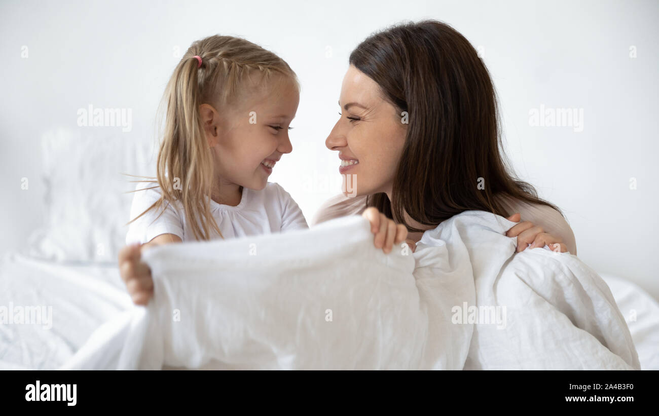 Child making bed with parent hi-res stock photography and images - Alamy