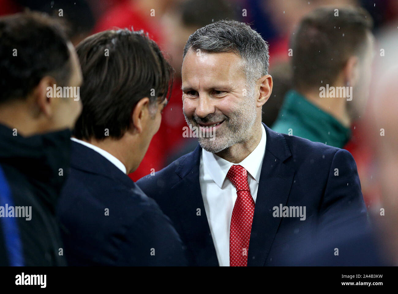 Wales manager Ryan Giggs (right) shakes hands with Croatia manager ...