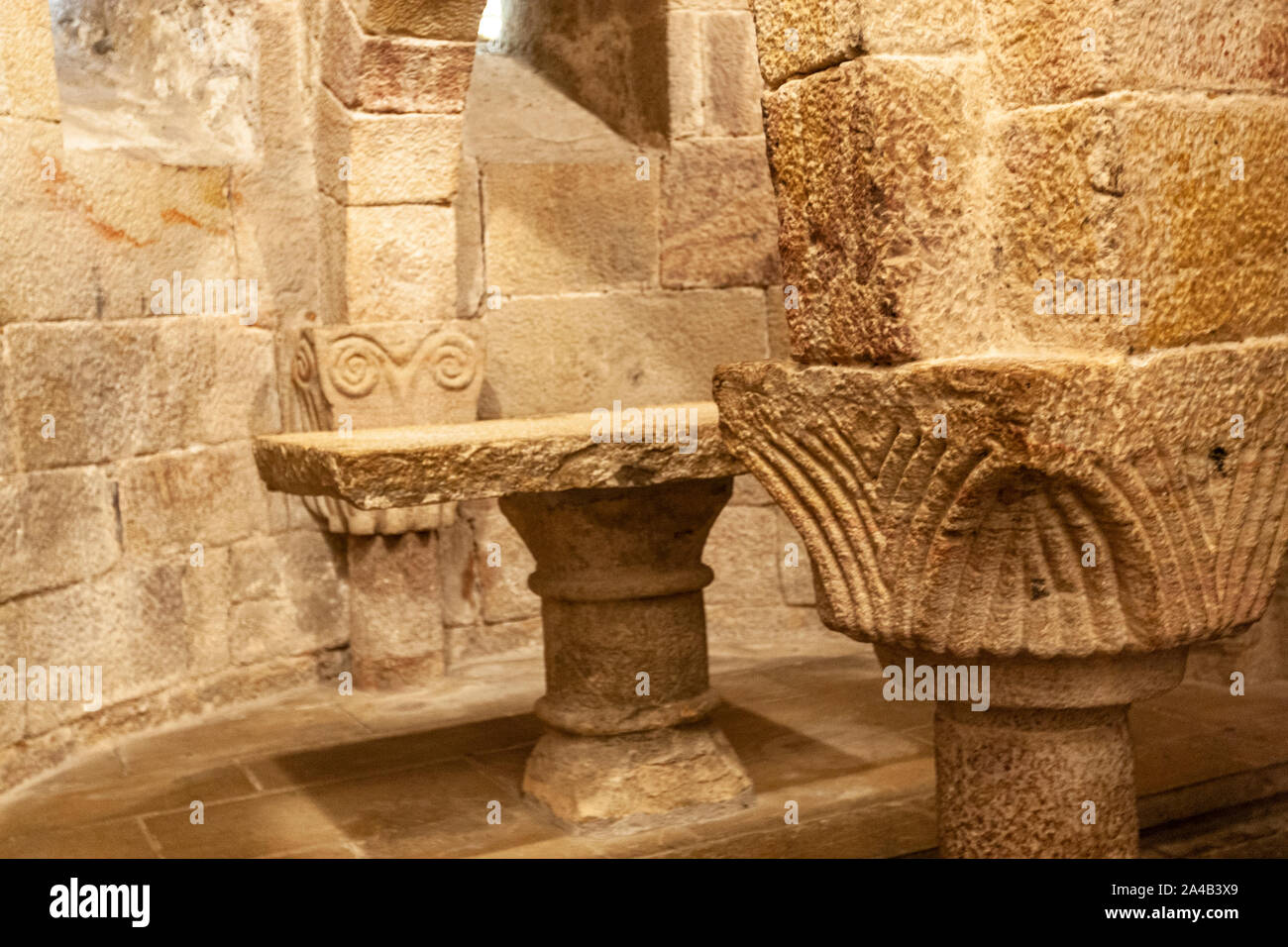 Arches and capital in Crypt, 11th century, of Monastery of Leyre ...