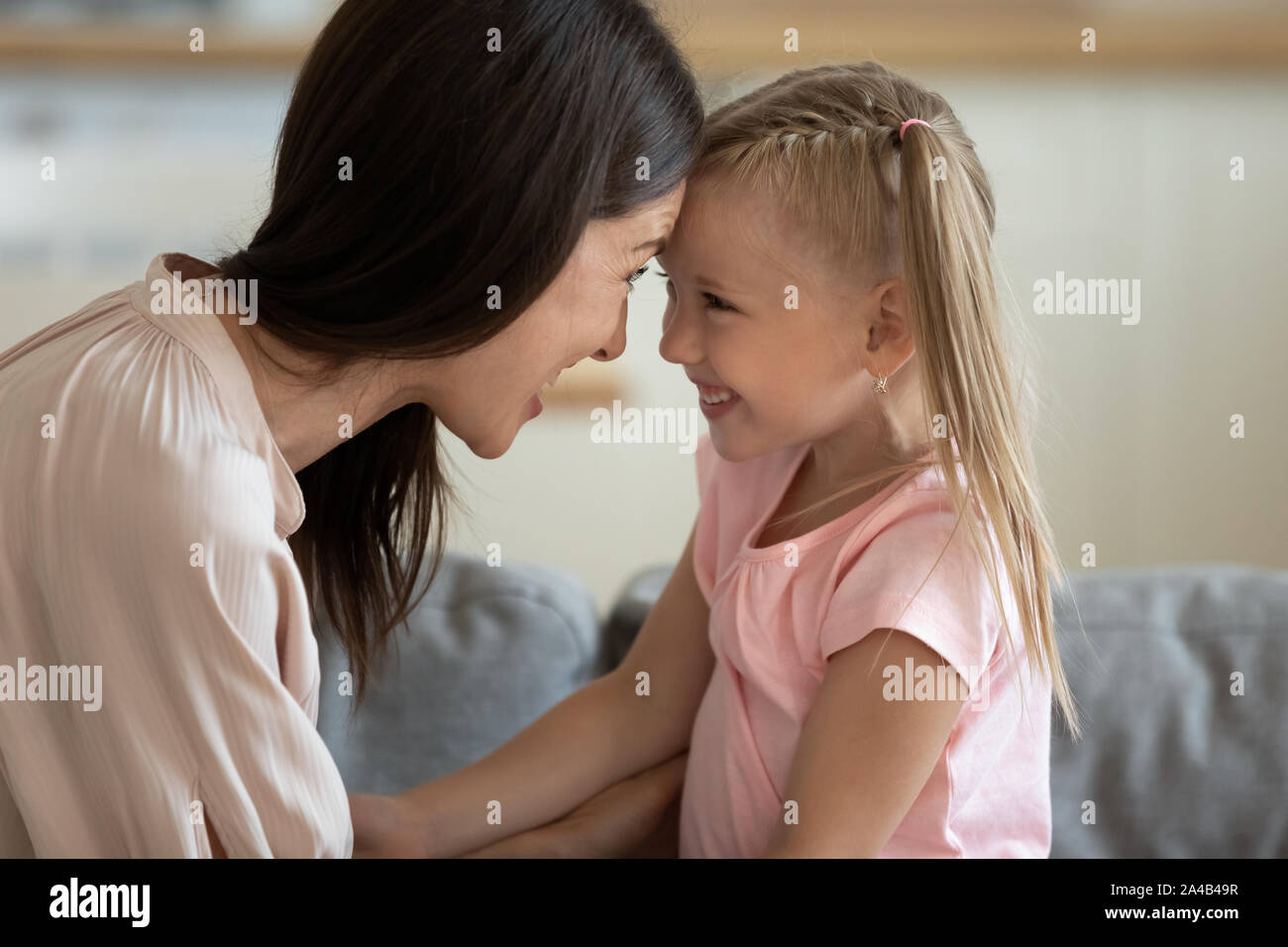 Two people foreheads touching hi-res stock photography and images - Alamy