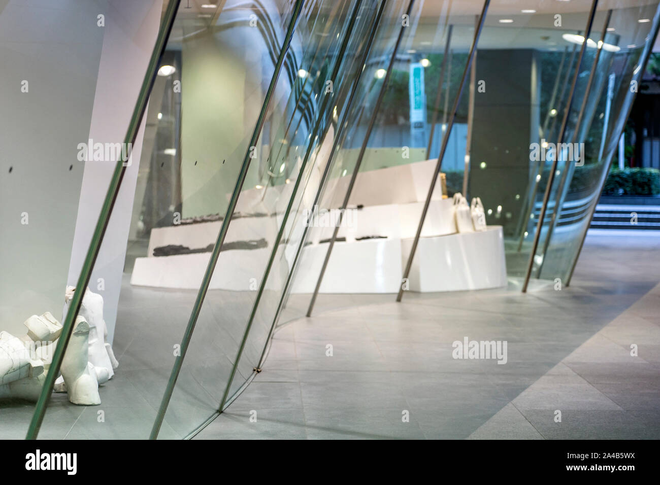 Close-Up the Bottom View of Double Curve Glass Panel of the Showcase ...