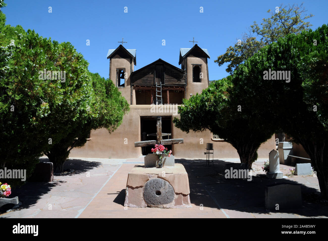 The entrance to El Santuario de Chimayo, an adobe built Roman Catholic ...