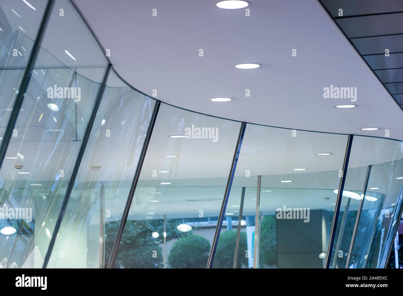 Close-Up the Top View of Double Curve Glass Panel of the Showcase ...