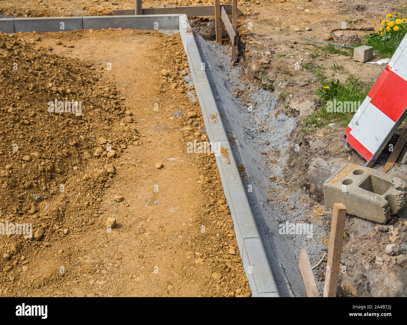 Curb laying walkway Stock Photo - Alamy