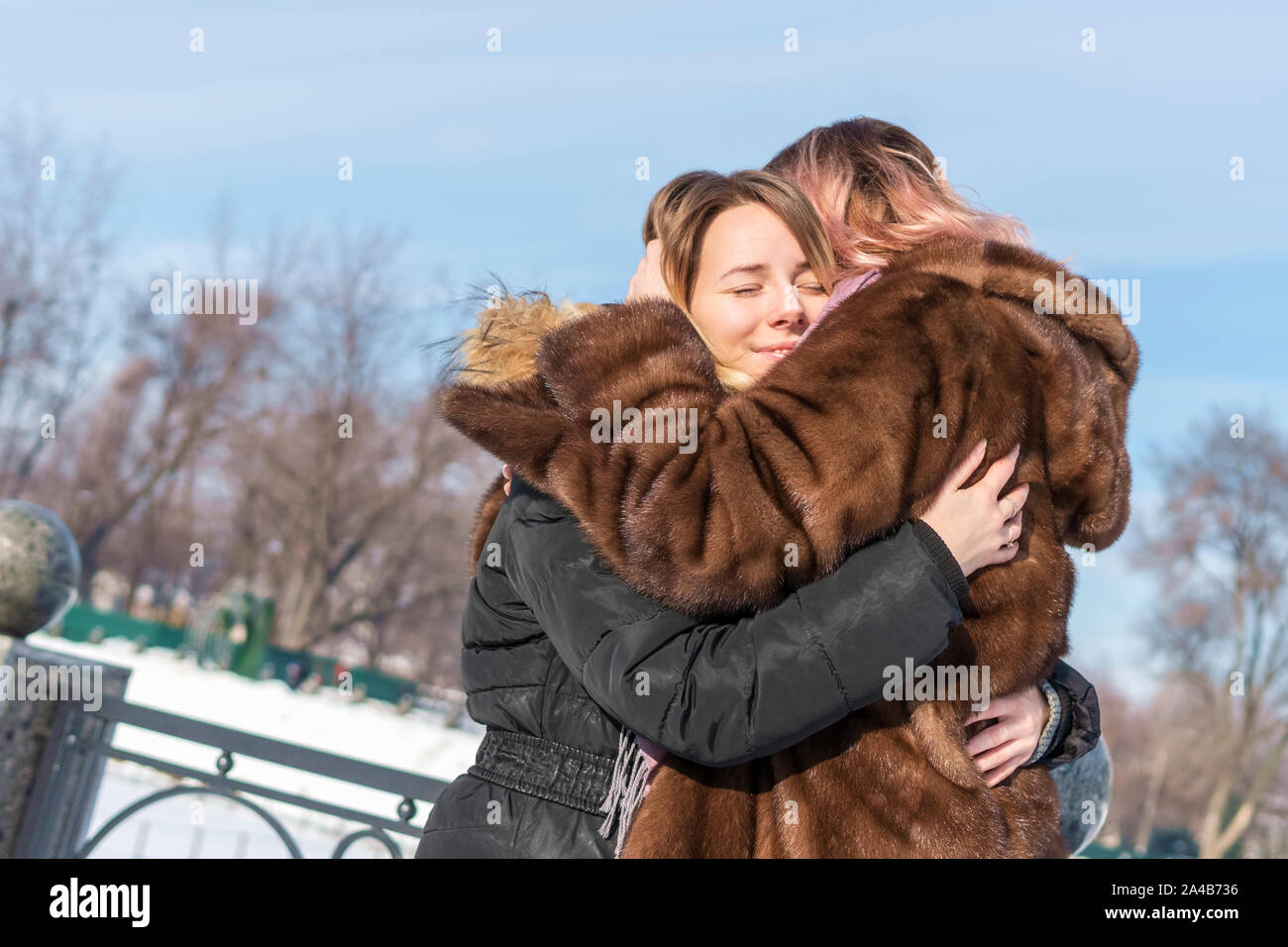 Two women hugging hi-res stock photography and images - Alamy