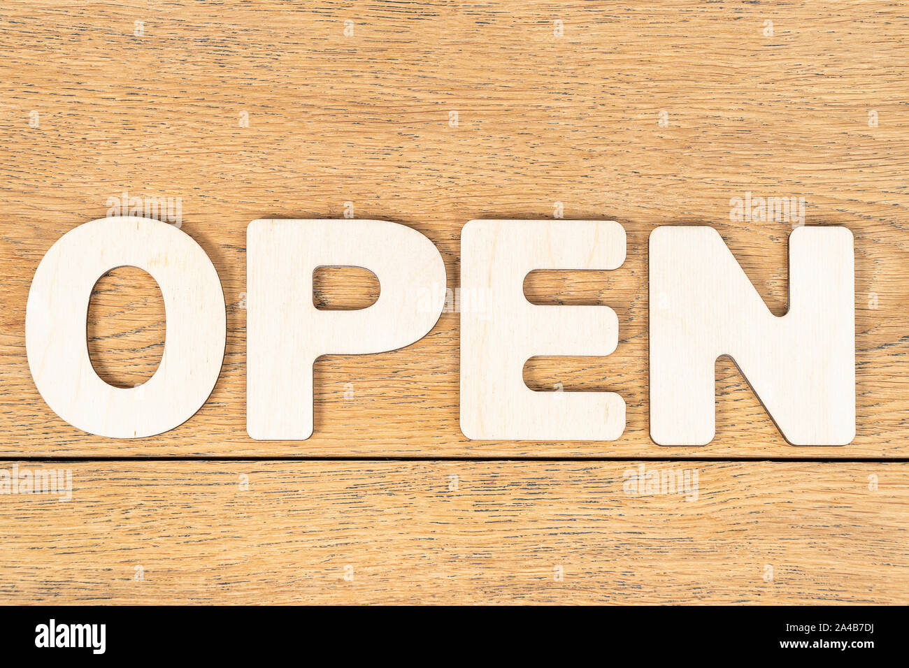 Word open wooden letters hi-res stock photography and images - Alamy