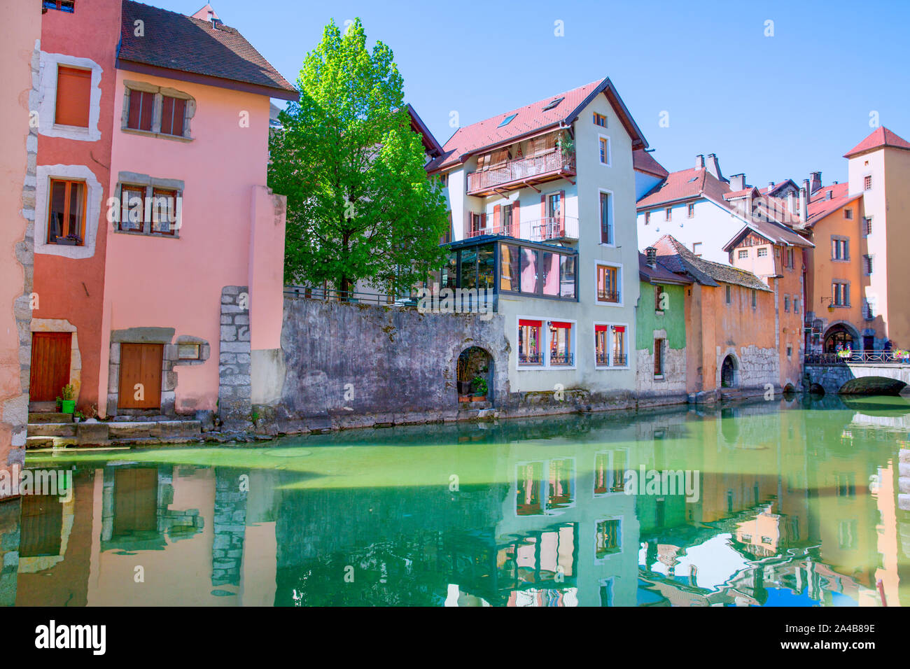 Beautiful narrow street with green canal in France. Annecy town. Old ...