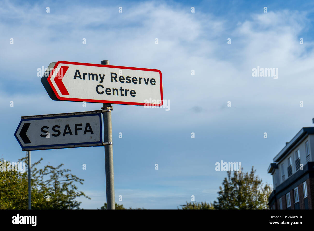 an army reserve centre sign and a SSAFA sign on a lamp post Stock Photo ...