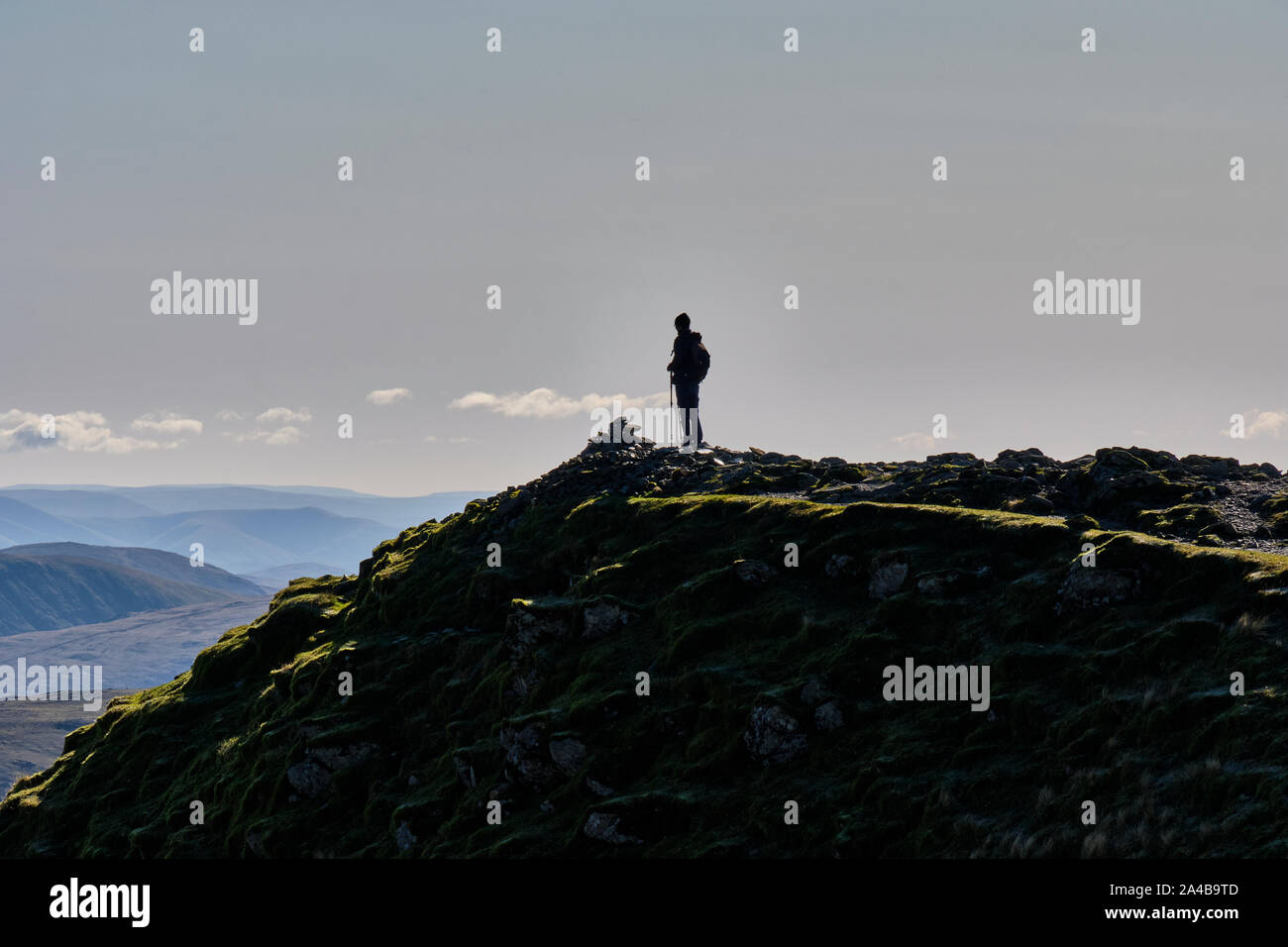 Lone hiker mountain summit hi-res stock photography and images - Alamy