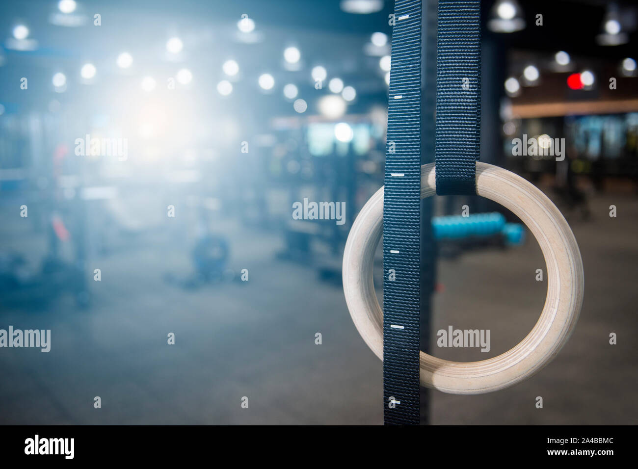 Gymnastic rings hanging at cross fitness box Stock Photo - Alamy